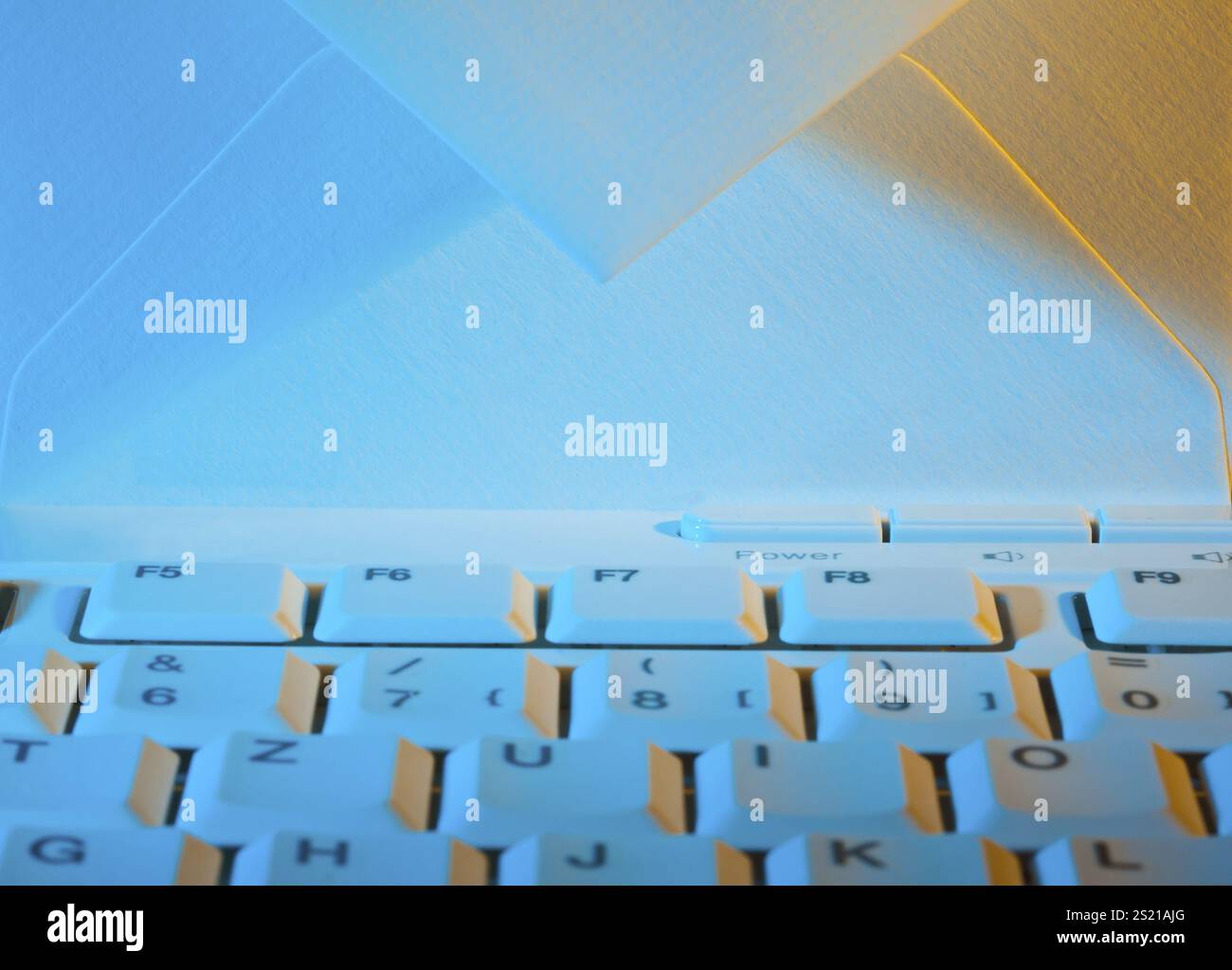 The keyboard of a computer and an envelope. Communication via e-mail ...