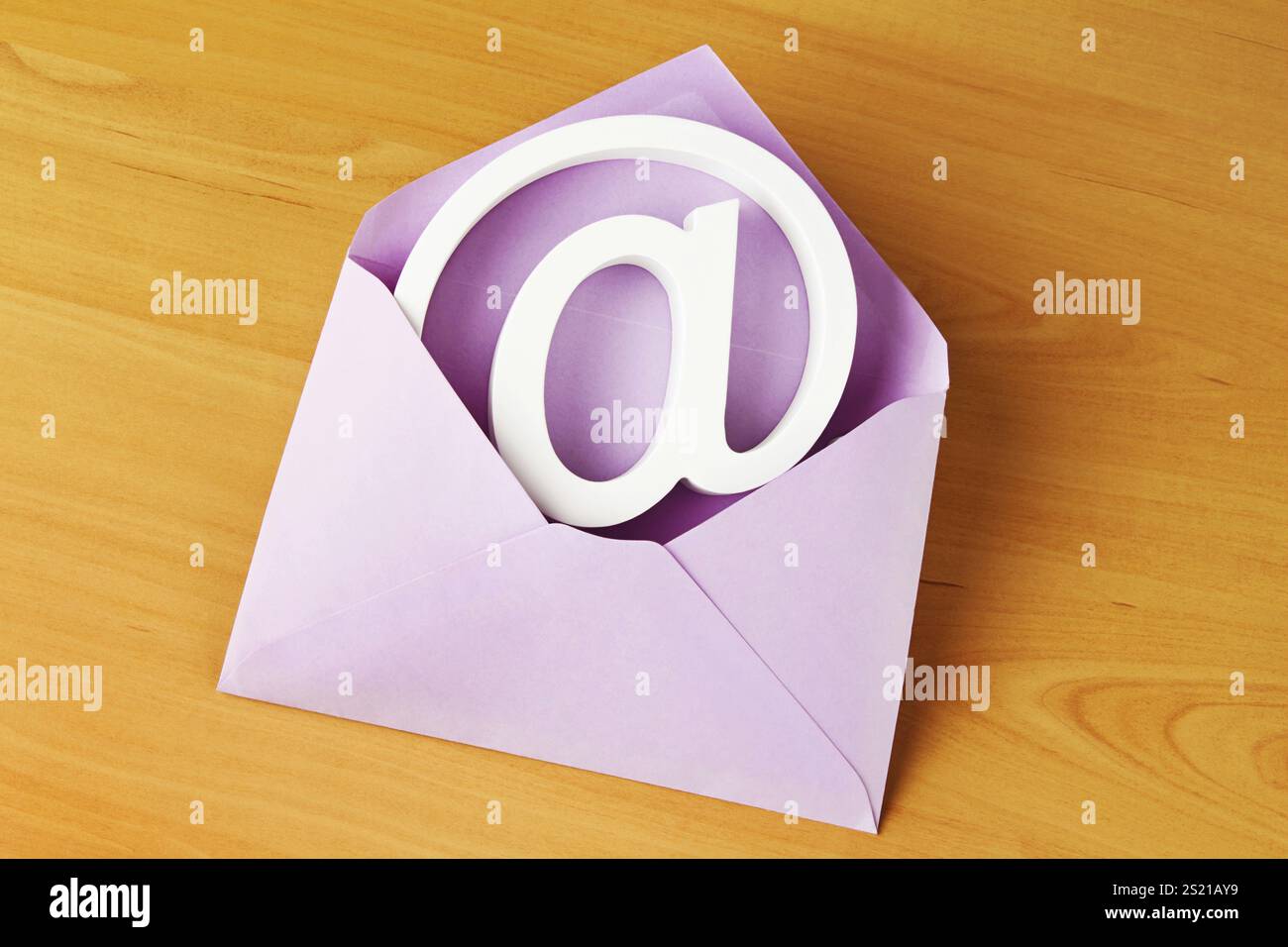 There is an e-mail sign in an envelope. Letter post against electronic ...