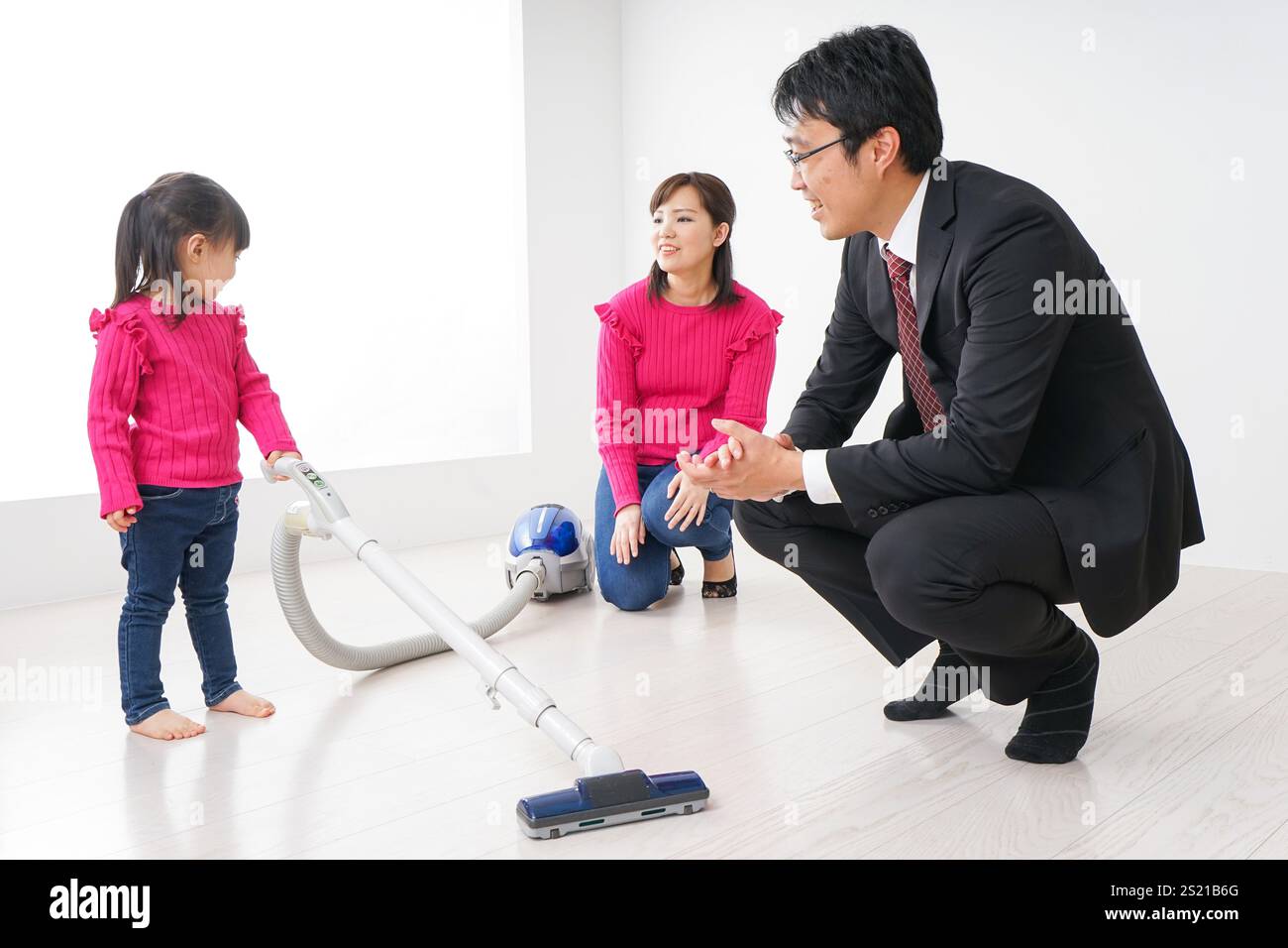 Father and mother and daughter going to work Stock Photo - Alamy