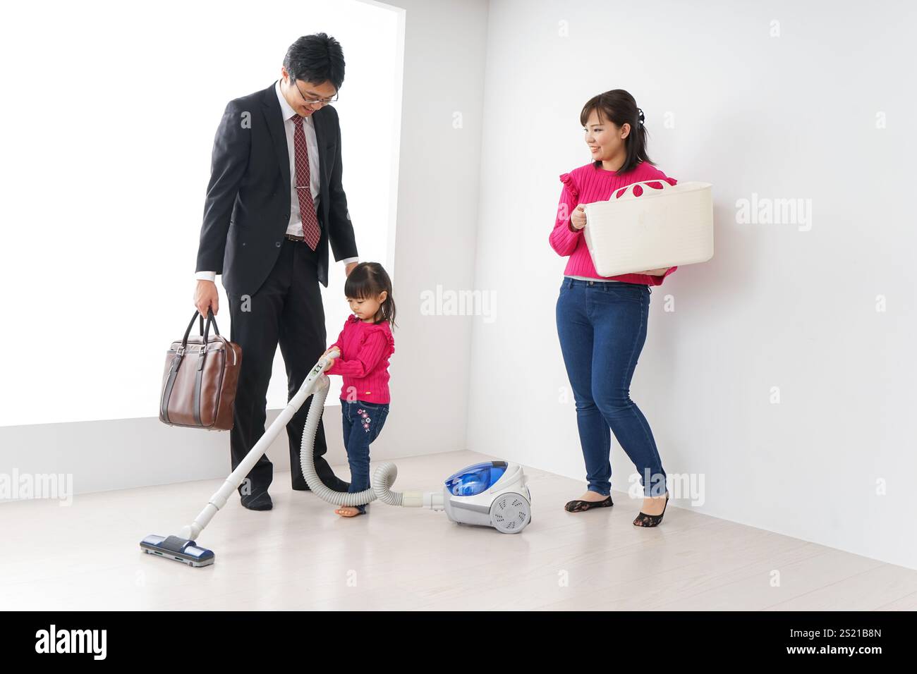 Father and mother and daughter going to work Stock Photo - Alamy