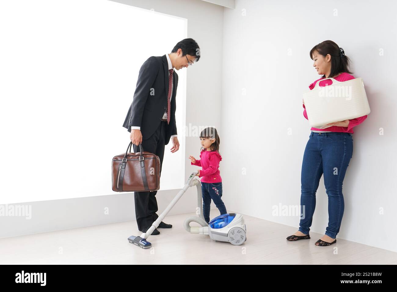 Father and mother and daughter going to work Stock Photo - Alamy