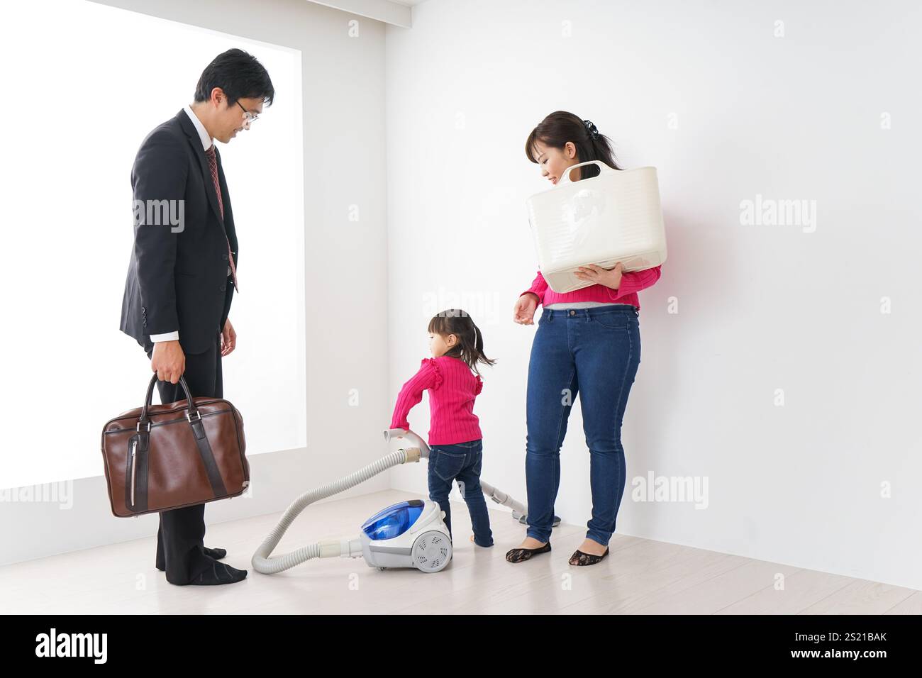 Father and mother and daughter going to work Stock Photo - Alamy