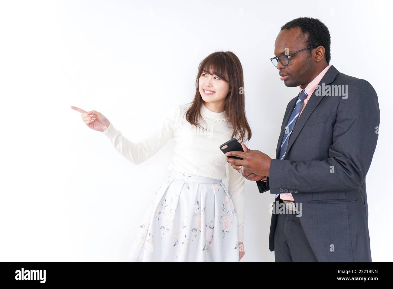 Young woman giving directions to a foreigner Stock Photo - Alamy