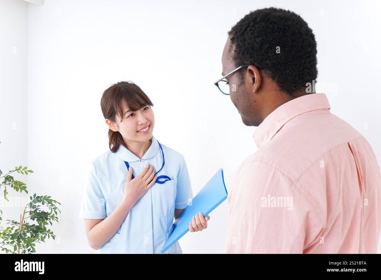Black man receiving medical attention at hospital Stock Photo - Alamy