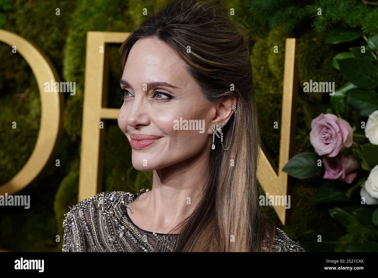 Angelina Jolie arrives at the 82nd Golden Globes on Sunday, Jan. 5 ...
