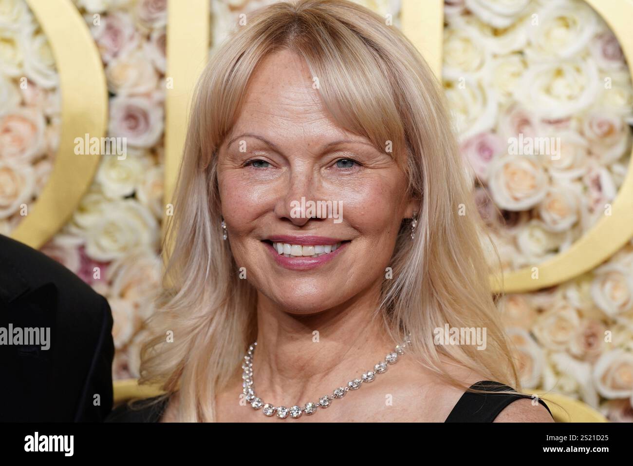 Pamela Anderson arrives at the 82nd Golden Globes on Sunday, Jan. 5 ...