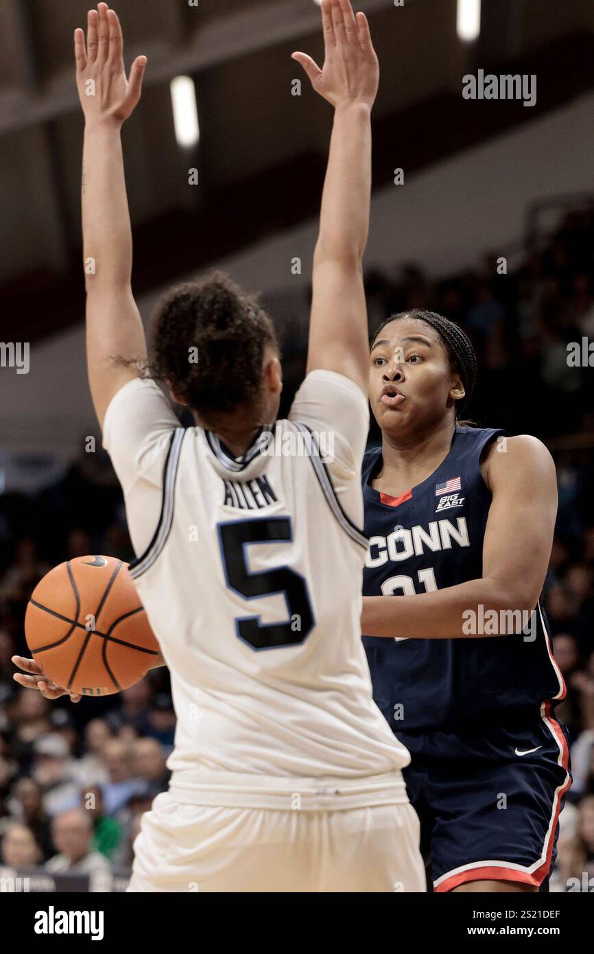 UConn's Sarah Strong, right, looks to pass the ball around Villanova's ...
