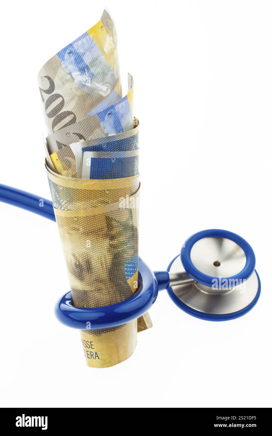 Health costs with Swiss francs and stethoscope Stock Photo - Alamy
