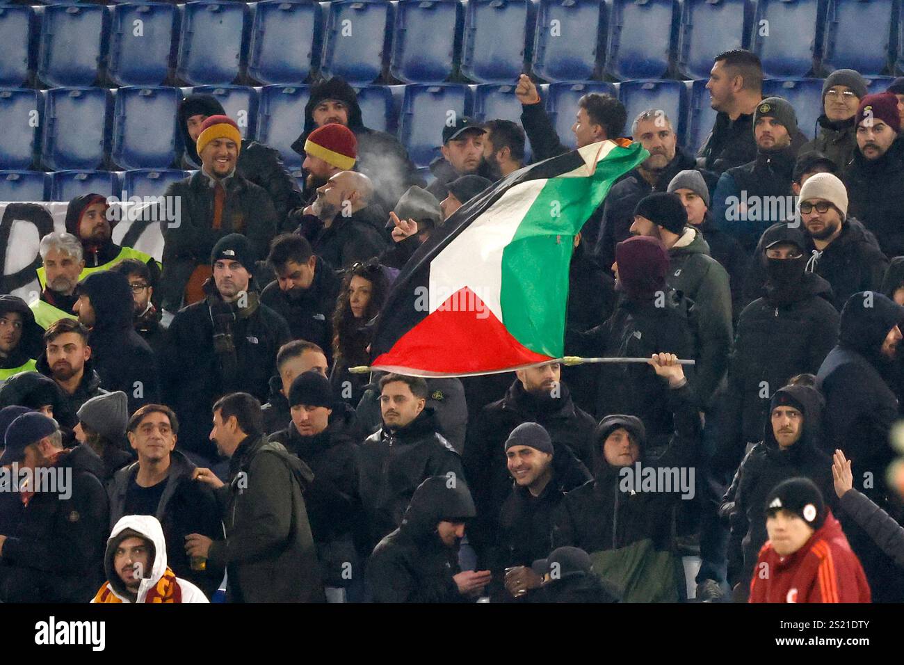 Rome, Italy. 5th Jan, 2025. Roma fans wave a Palestinian flag during ...