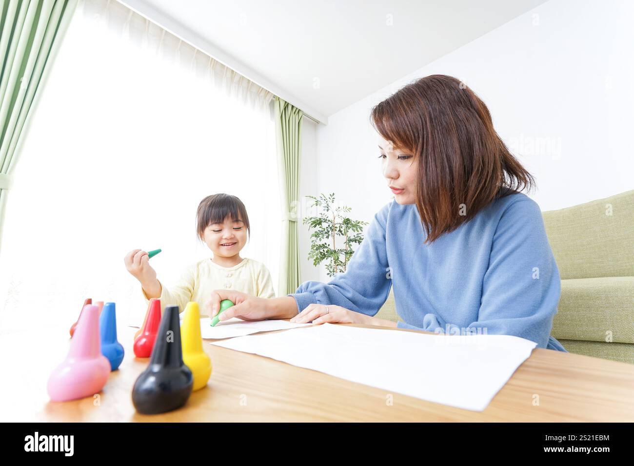 Parent and child drawing Stock Photo - Alamy