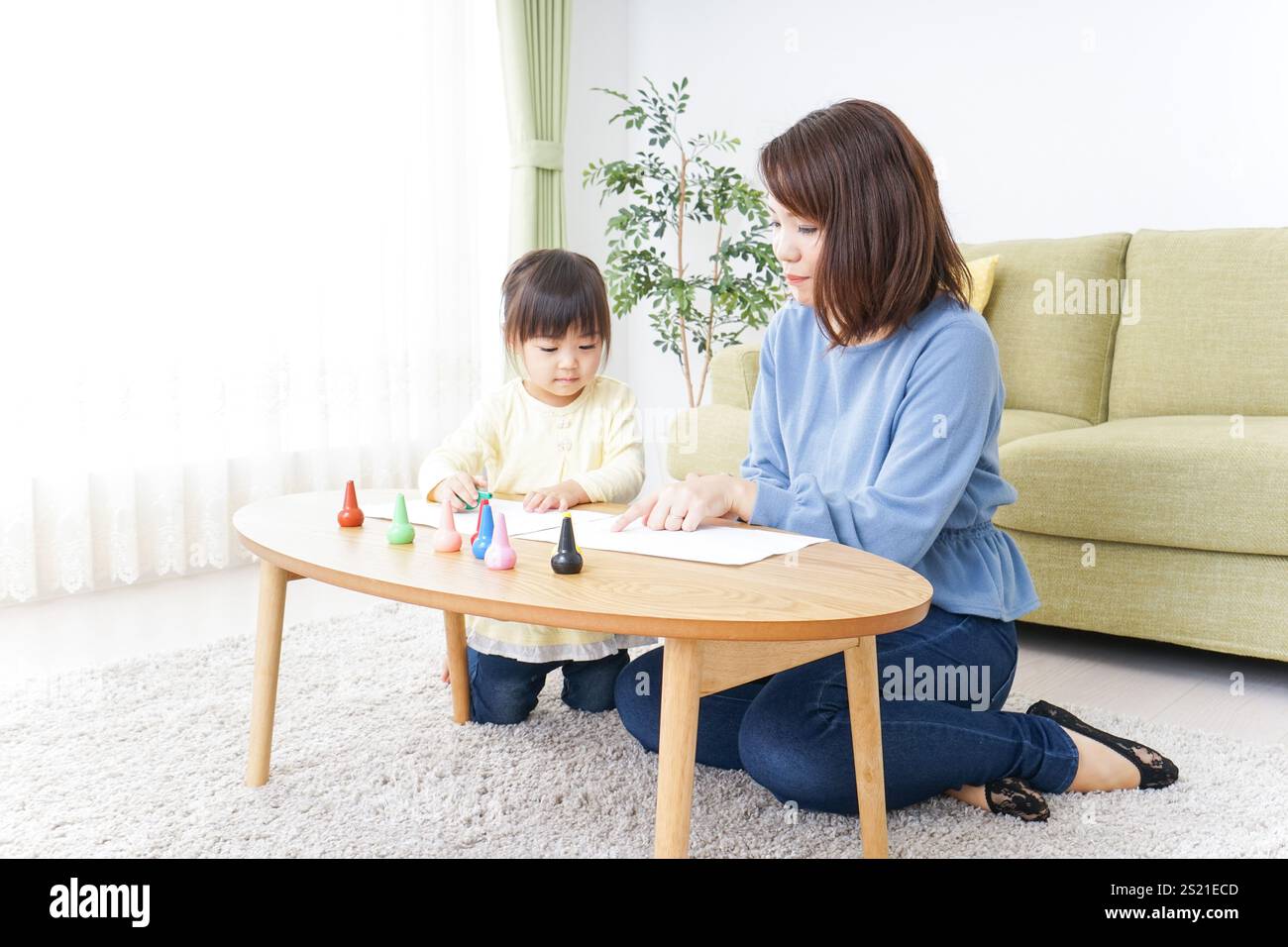 Parent and child drawing Stock Photo - Alamy