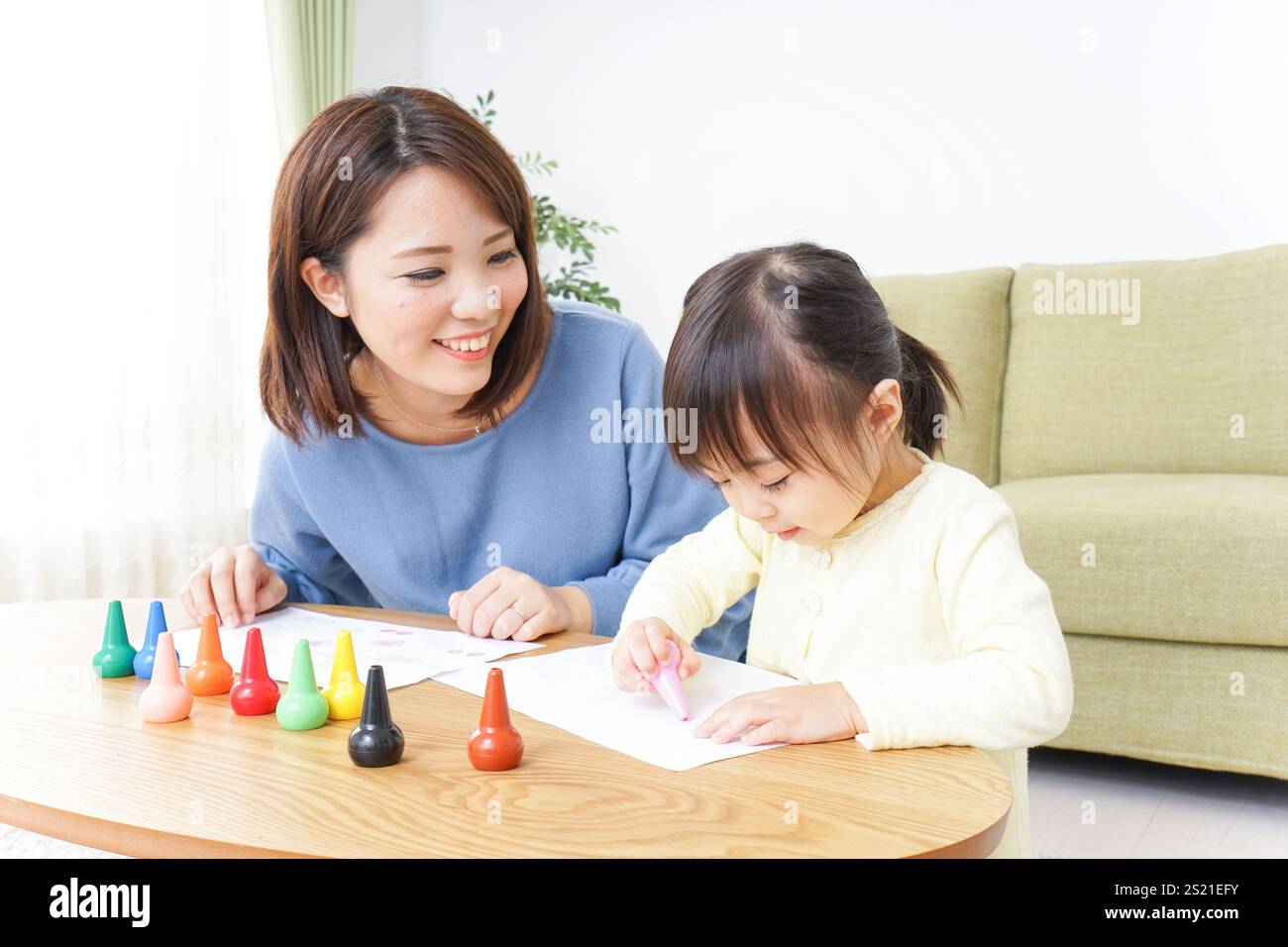 Parent and child drawing Stock Photo - Alamy