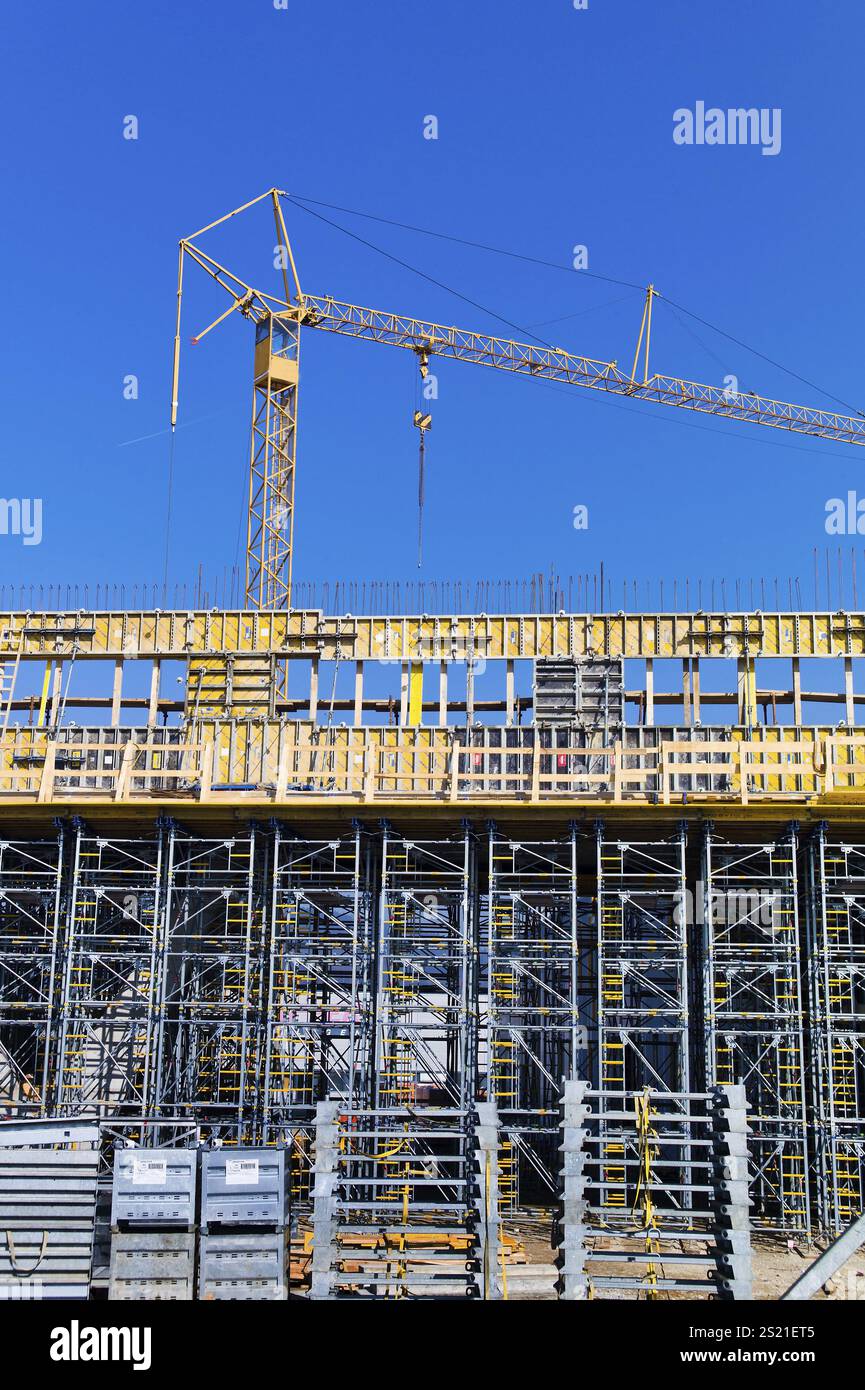 A concrete house or hall is being built. Building site with ...