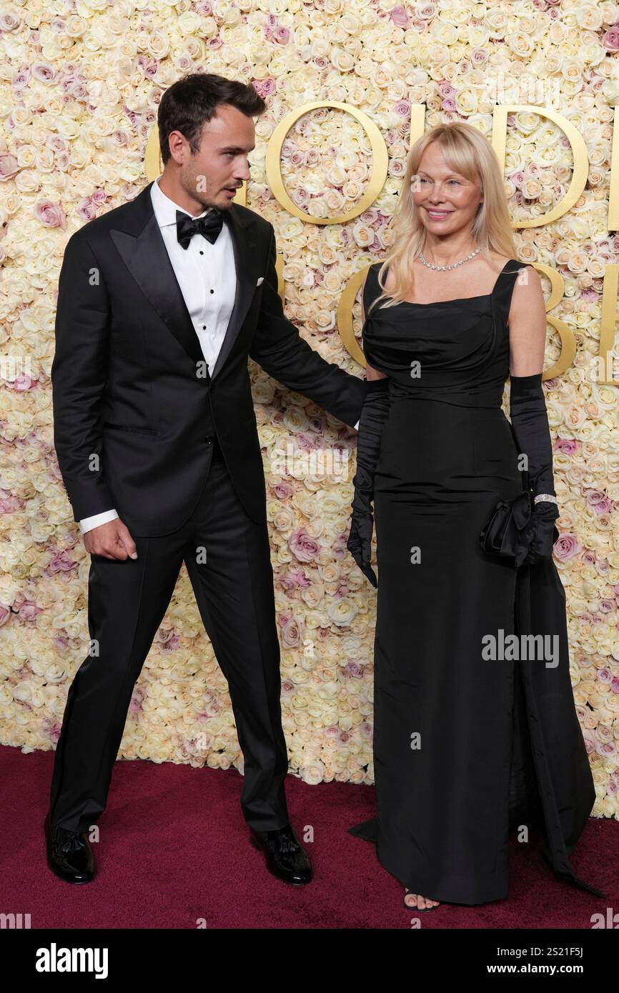 Brandon Thomas Lee, left, and Pamela Anderson arrive at the 82nd Golden ...