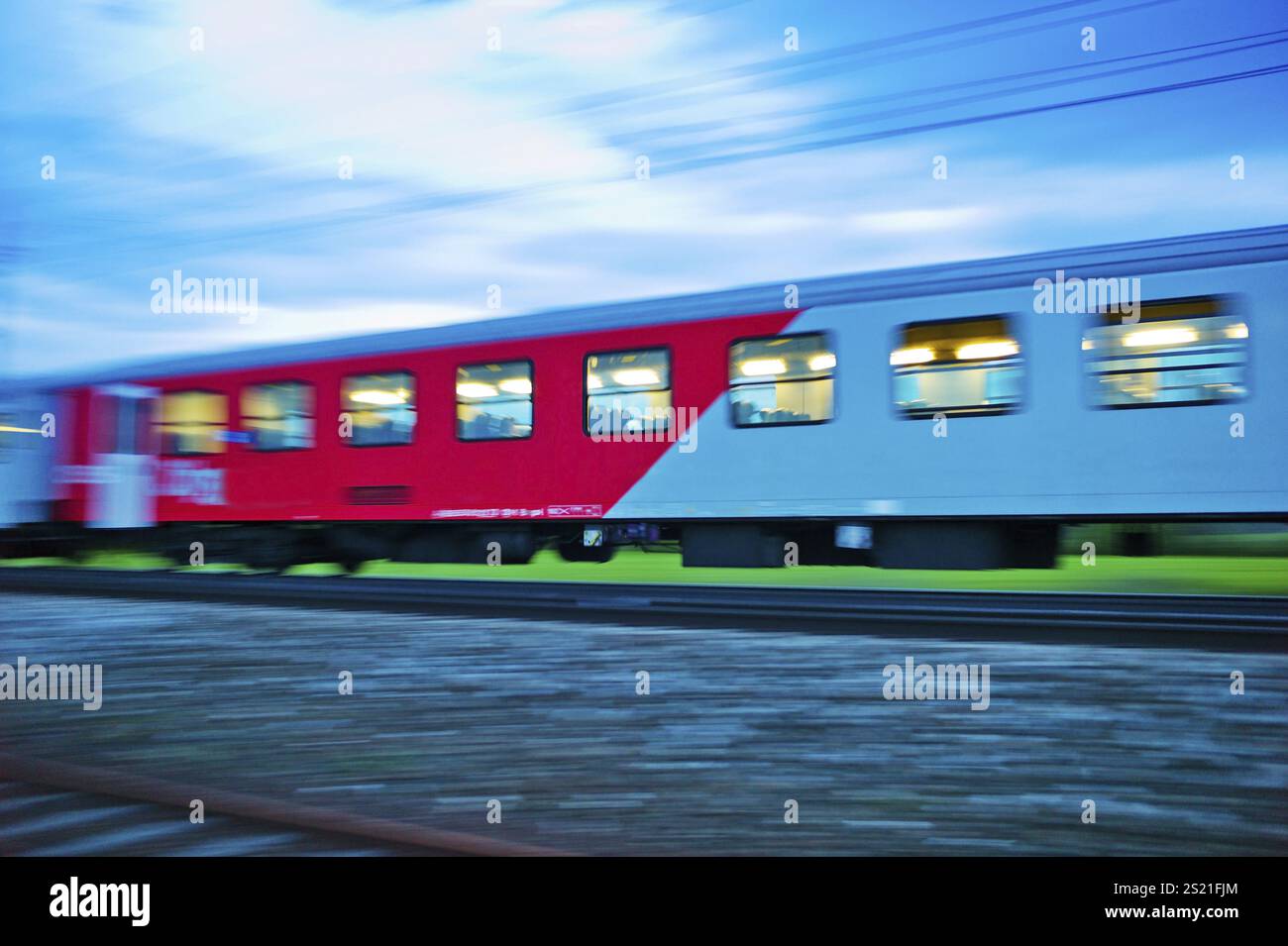 A passenger train travelling through the night. Night train with OeBB ...