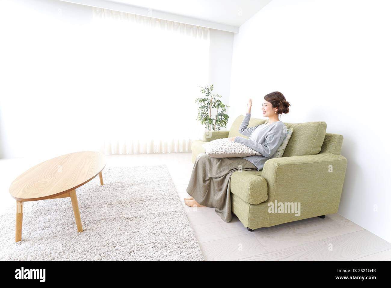 Women living alone relaxing at home Stock Photo - Alamy