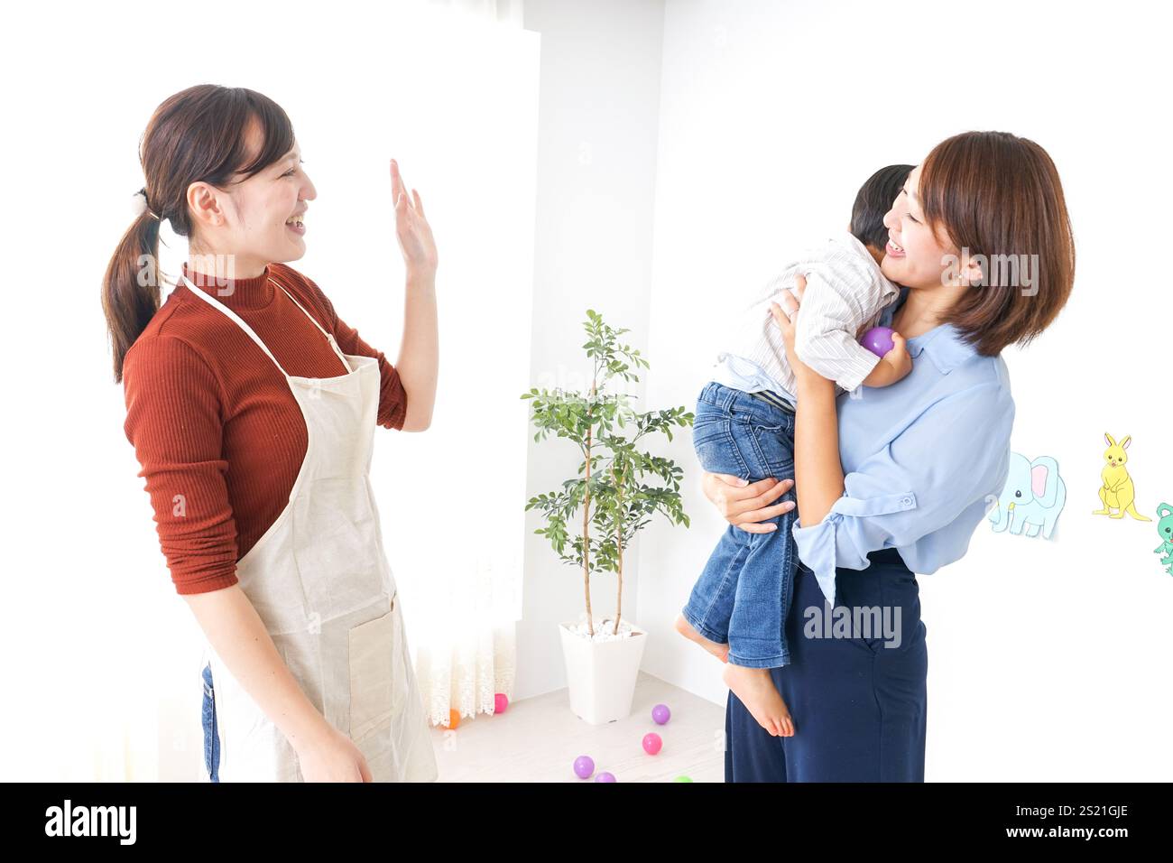 Mother picking up her child from kindergarten Stock Photo - Alamy
