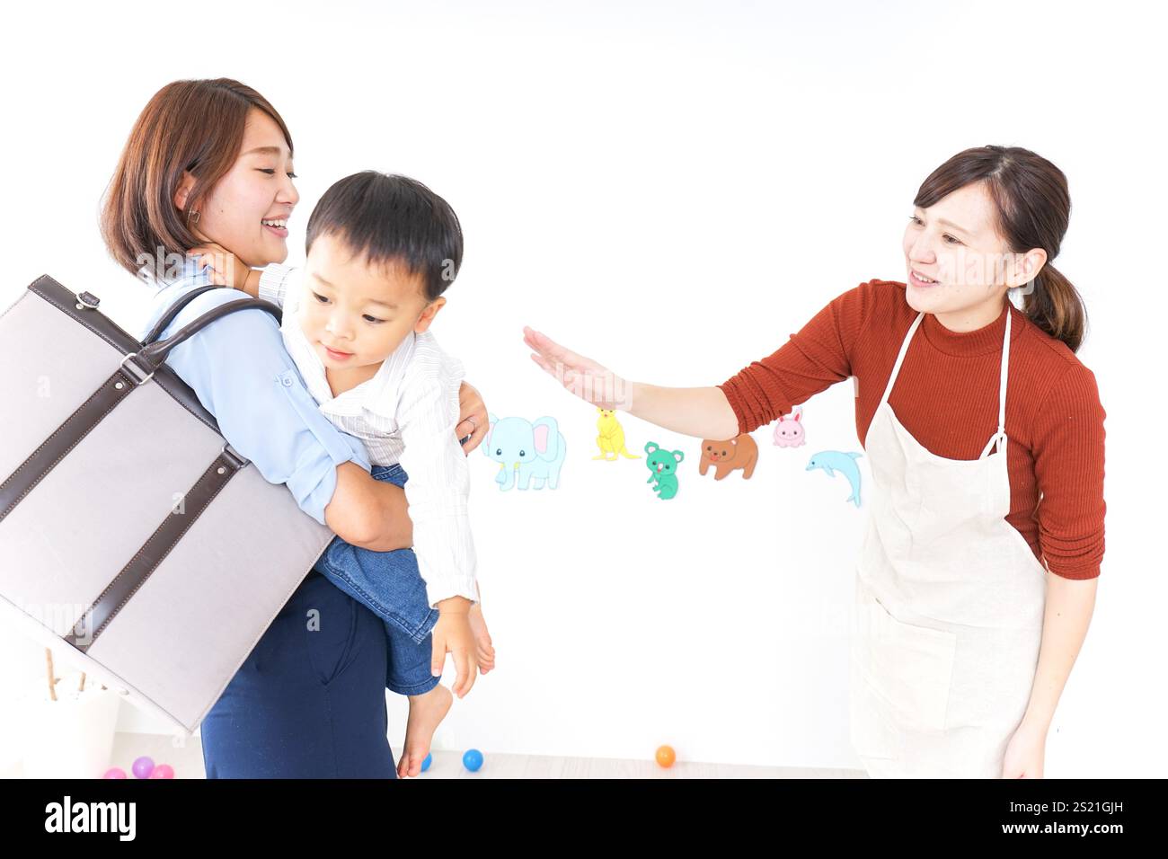 Mother picking up her child from kindergarten Stock Photo - Alamy