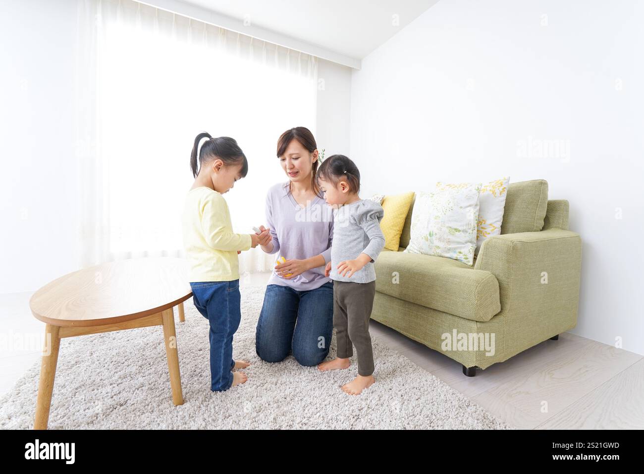 Child and mother setting hair Stock Photo - Alamy