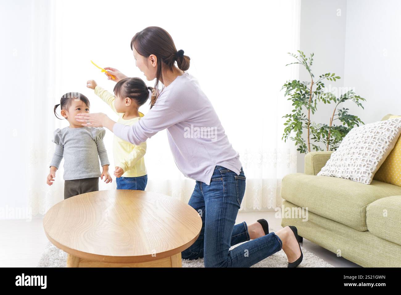 Child and mother setting hair Stock Photo - Alamy