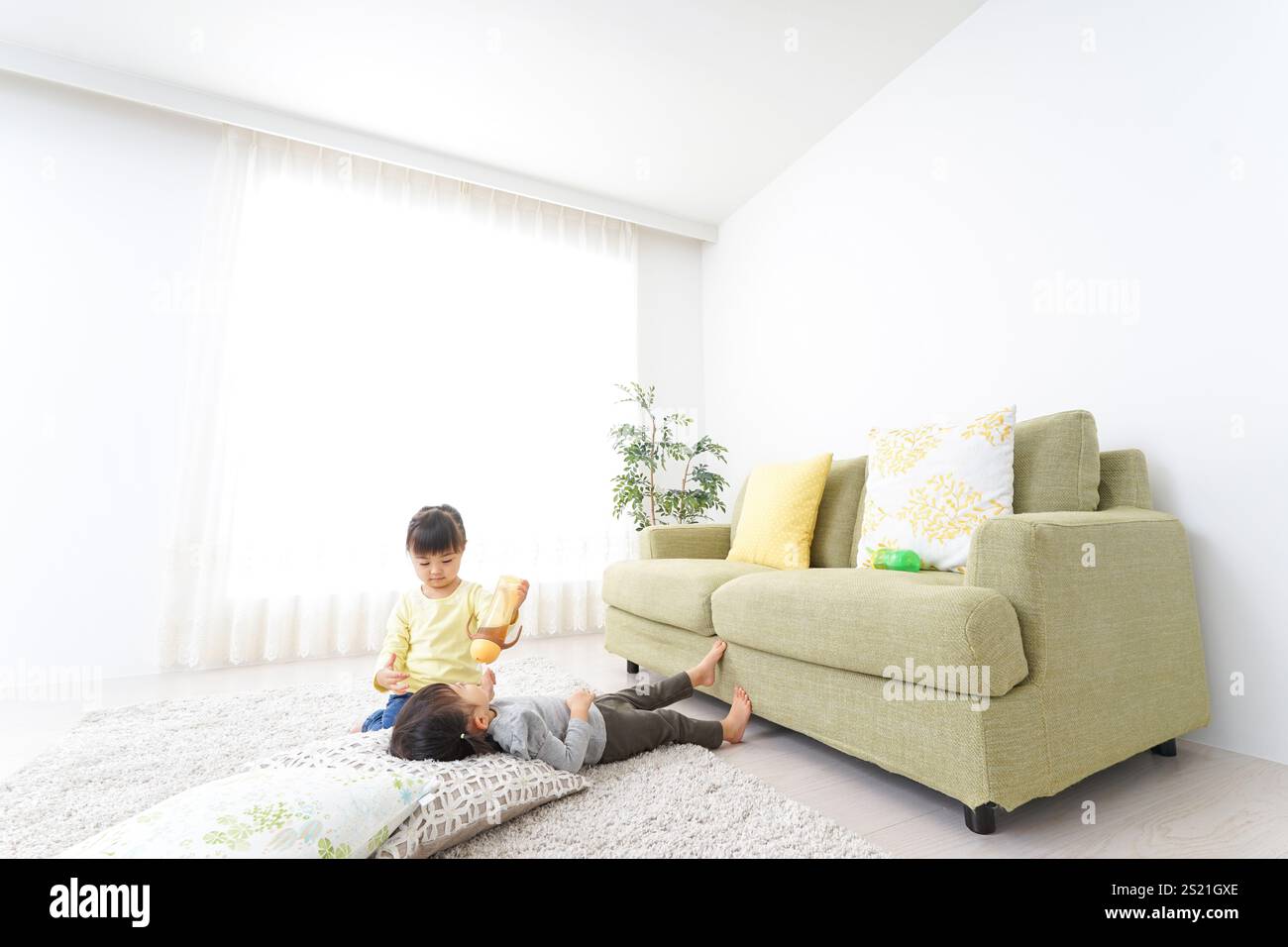 Child taking care of younger sister Stock Photo - Alamy