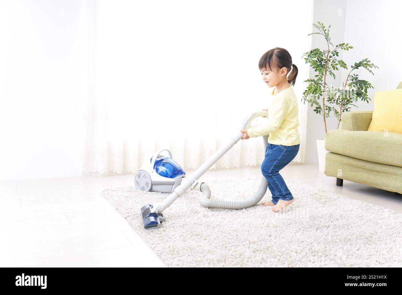 Child cleaning the room Stock Photo - Alamy