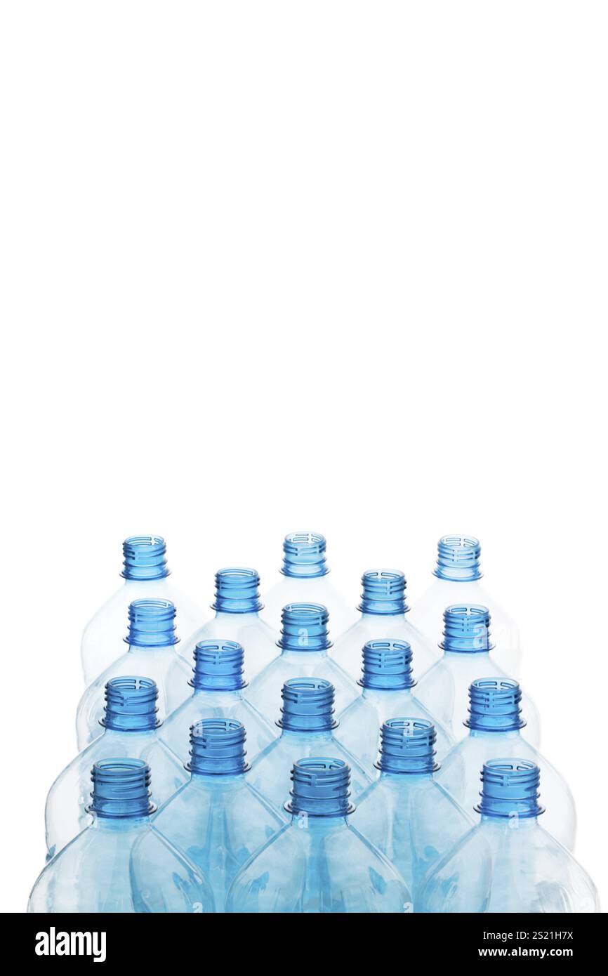 Many empty plastic bottles isolated in front of a white background ...