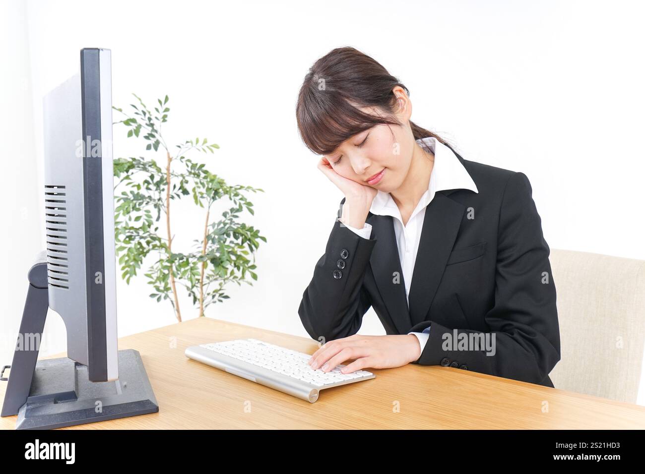 Sleep deprived and dozing business woman Stock Photo - Alamy