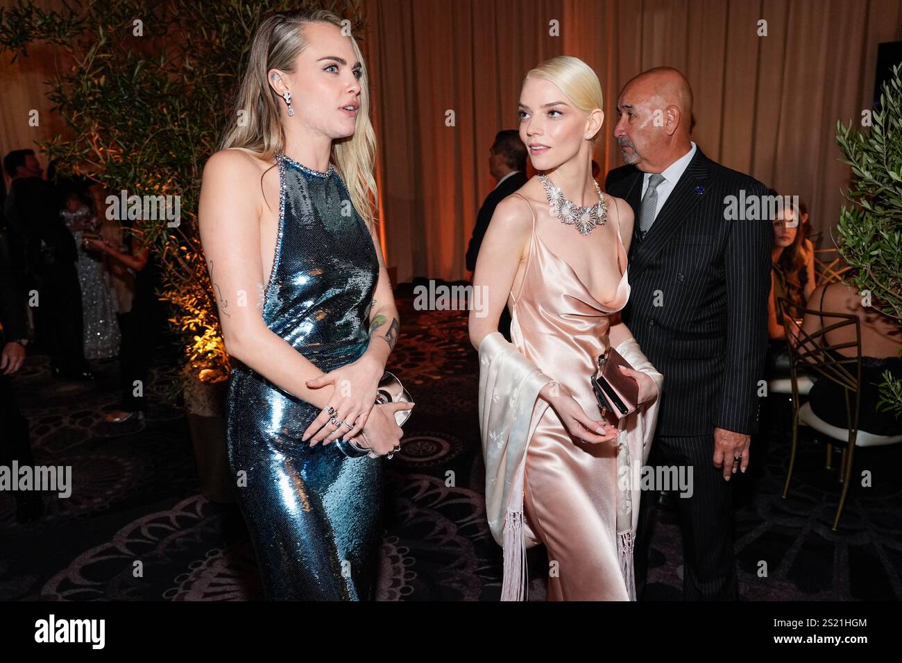 Cara Delevingne, left, and Anya Taylor-Joy arrive at the 82nd Golden Globes on Sunday, Jan. 5 ...