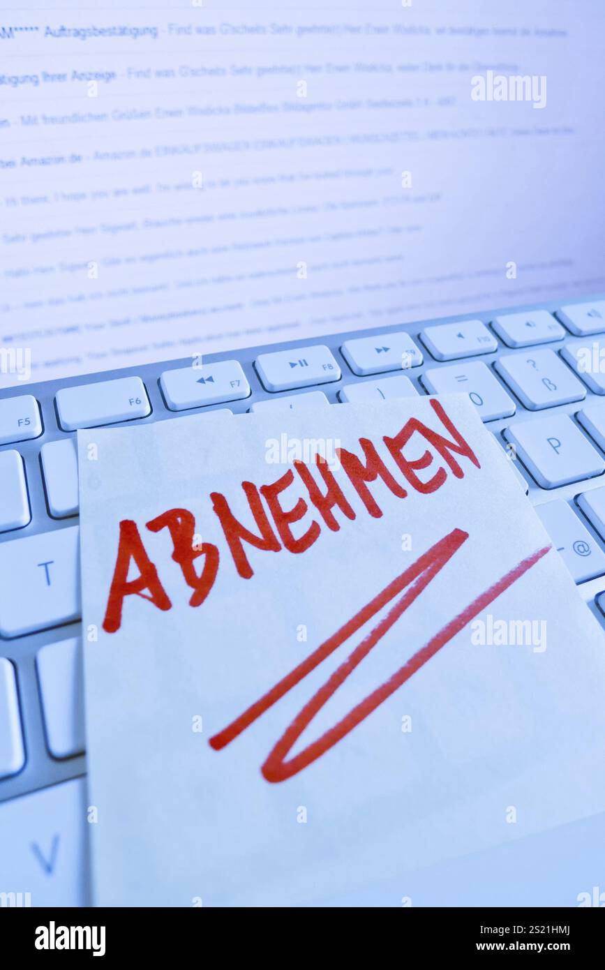 A note on the keyboard of a computer as a reminder: Take off Austria ...