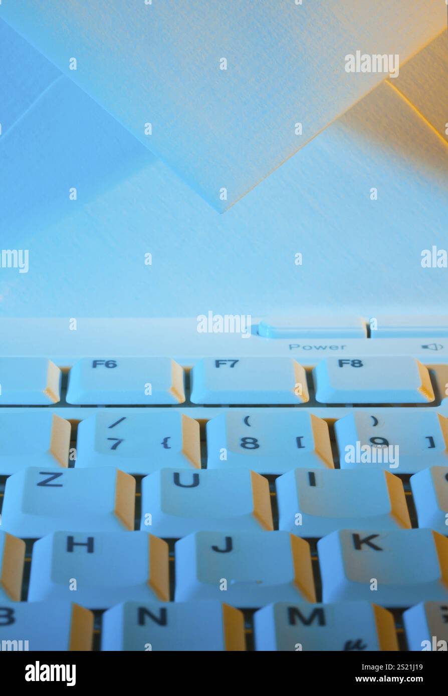 The keyboard of a computer and an envelope. Communication via e-mail ...