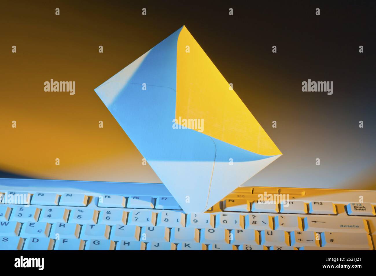 The keyboard of a computer and an envelope. Communication via e-mail ...