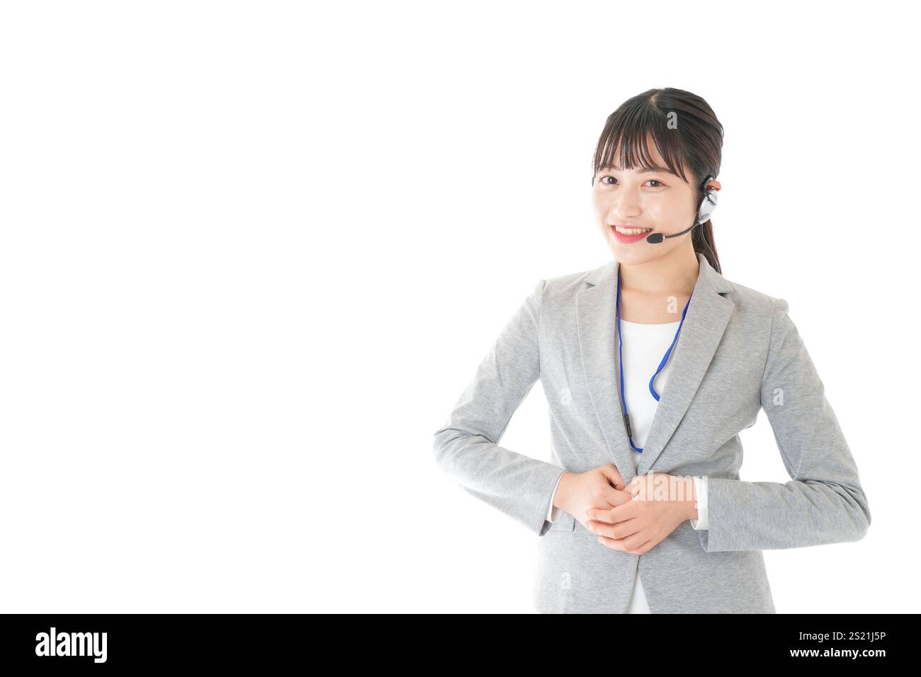 Woman at call centre responding with a smile Stock Photo - Alamy