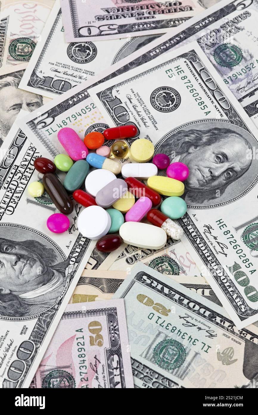 Cost of healthcare, tablets and dollar notes Austria Stock Photo - Alamy