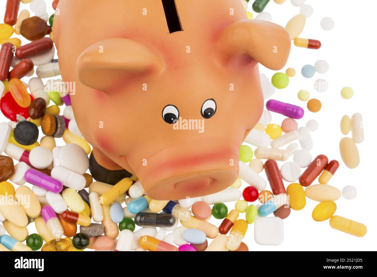 Tablets lying next to a piggy bank. Symbolic photo for costs in the ...