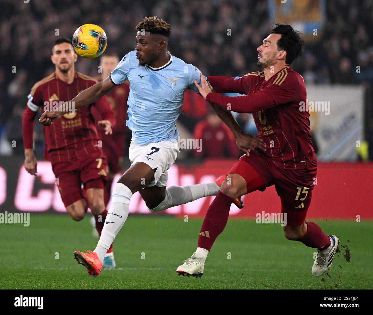Rome, Italy. 5th Jan, 2025. Roma's Mats Hummels (R) vies with Lazio's Fisayo Dele-Bashiru during ...