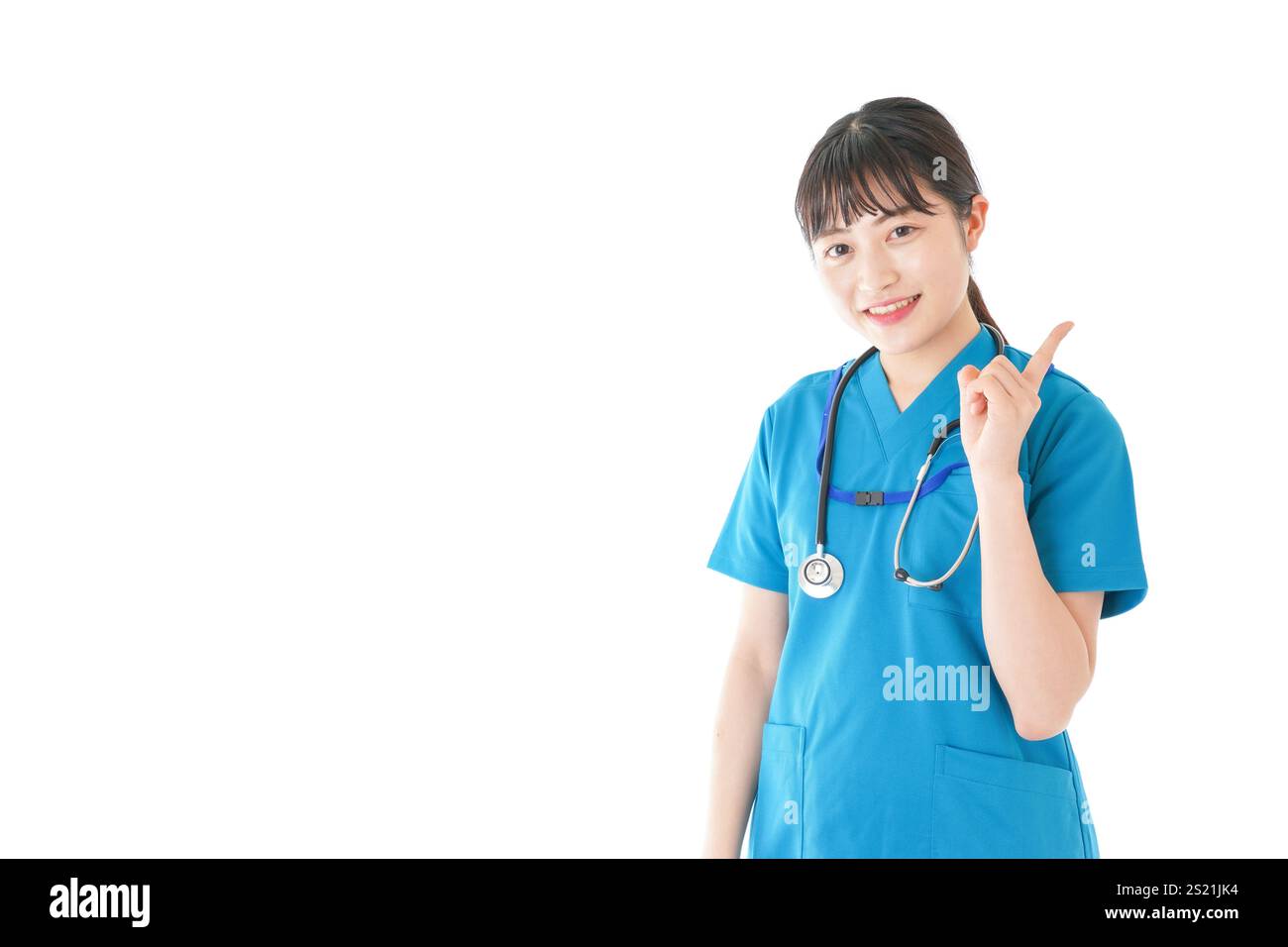 Smiling young nurse pointing fingers Stock Photo - Alamy