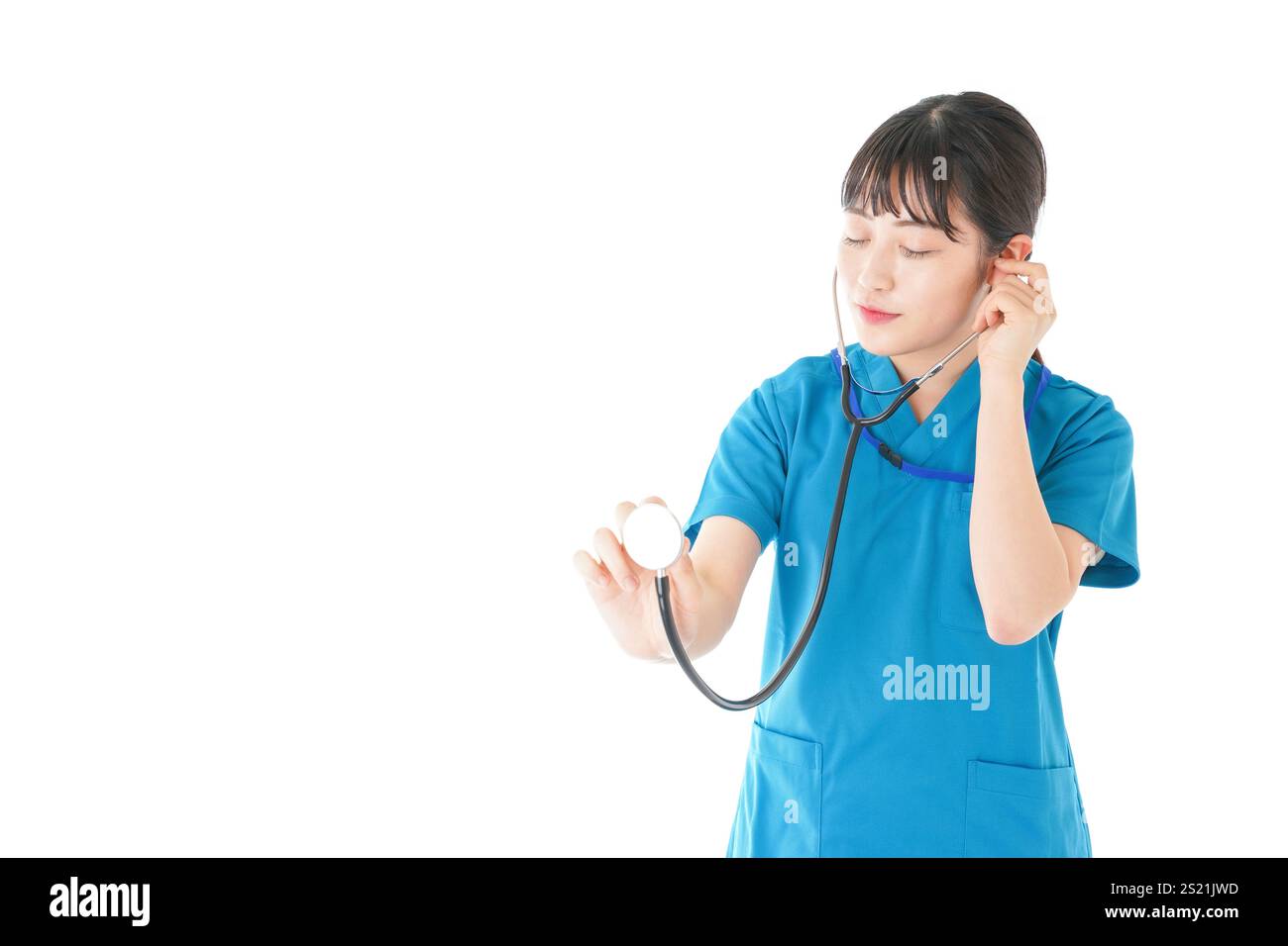 Nurse using stethoscope smiling Cut Out Stock Images & Pictures - Alamy