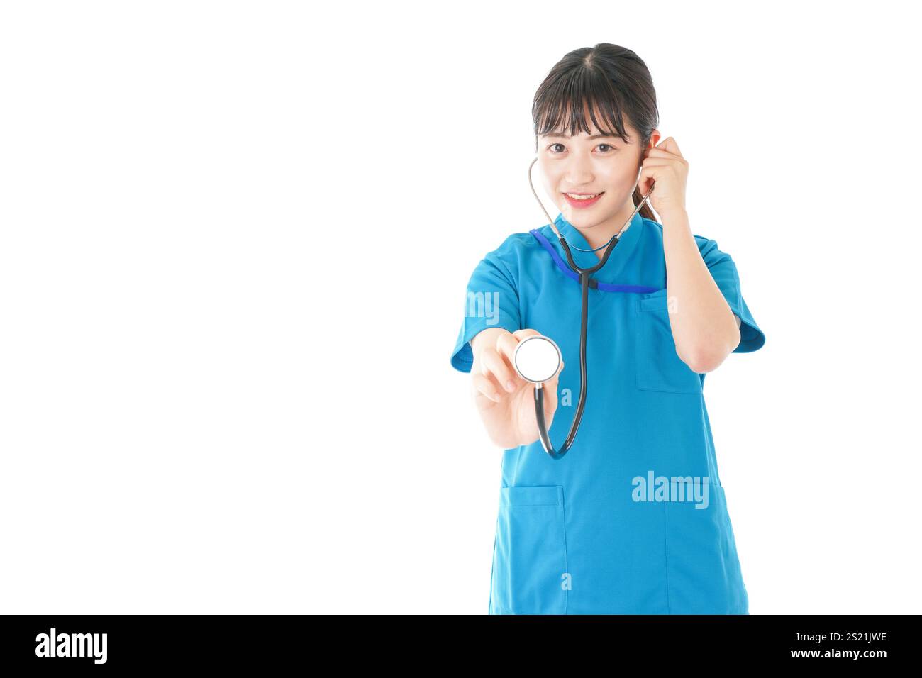 Smiling young nurse using stethoscope Stock Photo - Alamy