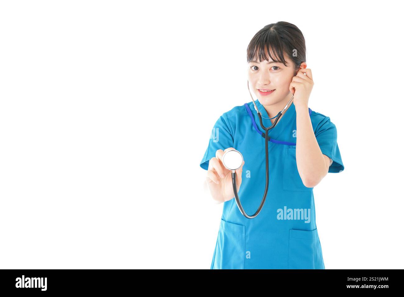 Smiling young nurse using stethoscope Stock Photo - Alamy