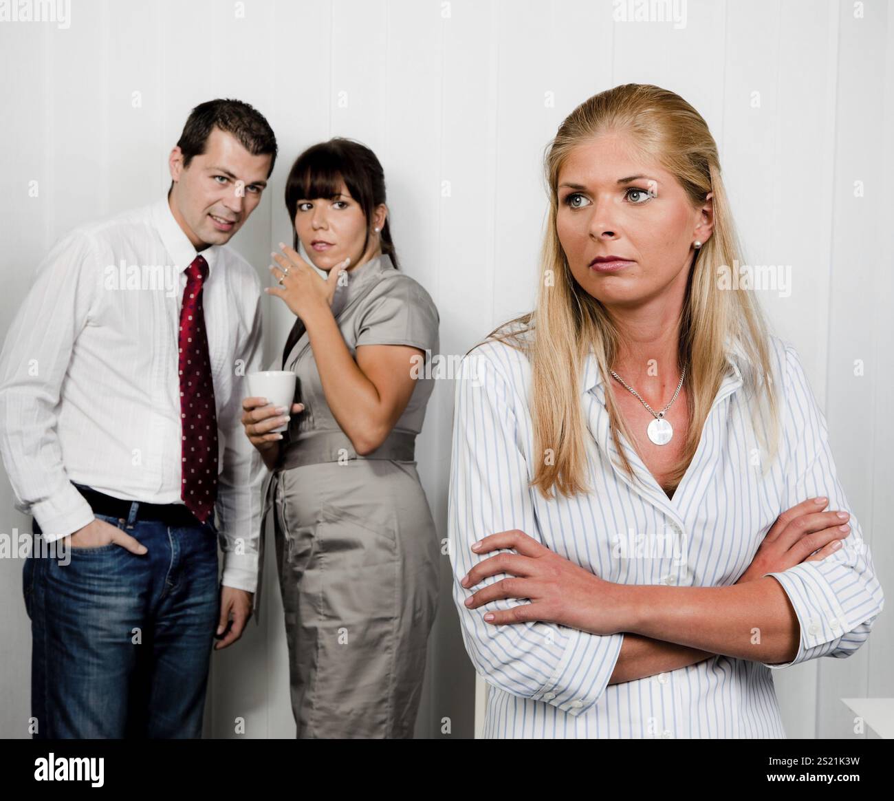 Workplace bullying in an office. Gossip in the office Austria Stock ...