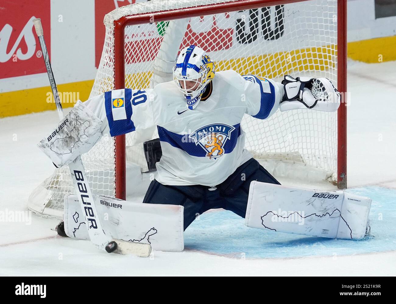 Finland goaltender Petteri Rimpinen makes a save during first-period ...