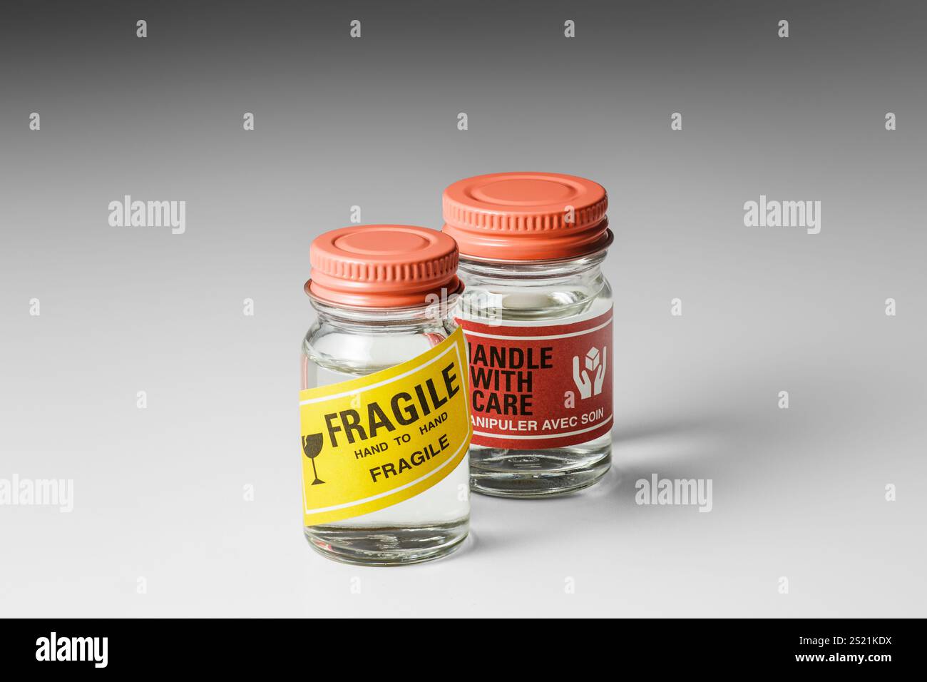 Bottle Caution against carrying Stock Photo - Alamy