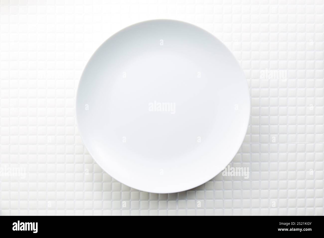 Mosaic tile - white - round plate Stock Photo - Alamy