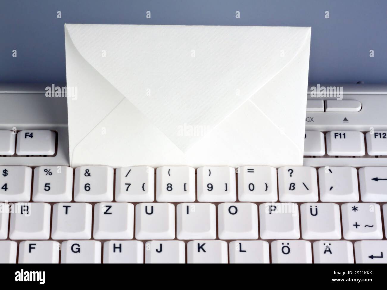 The keyboard of a computer and an envelope. Communication via e-mail ...