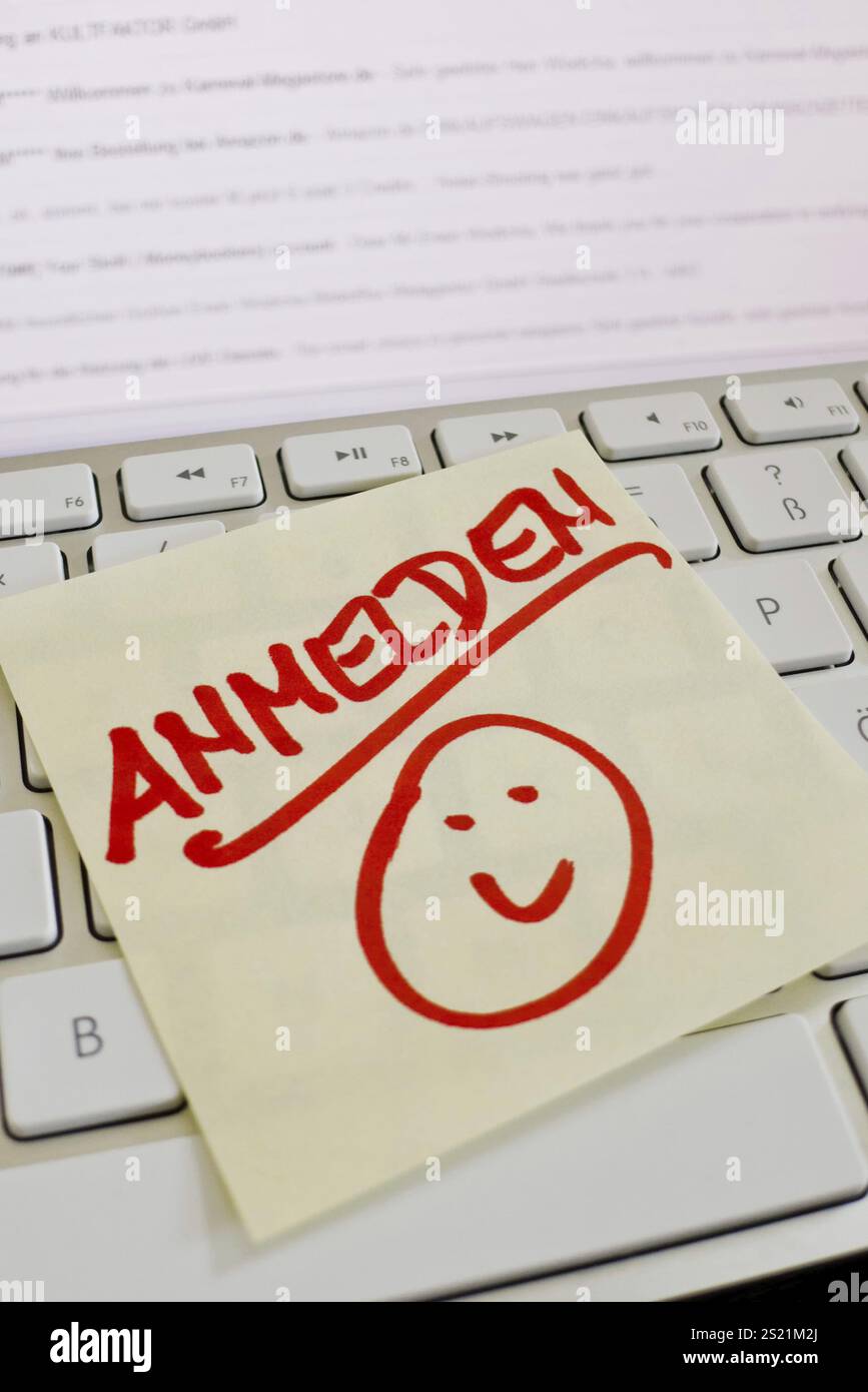 A note on the keyboard of a computer as a reminder: Log in Austria ...