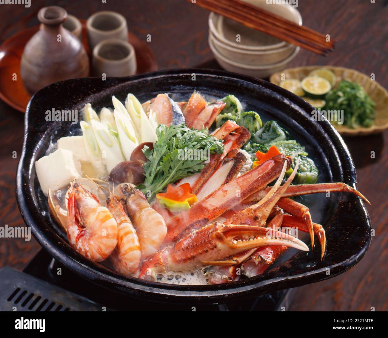 Dining table with crab casserole Stock Photo - Alamy