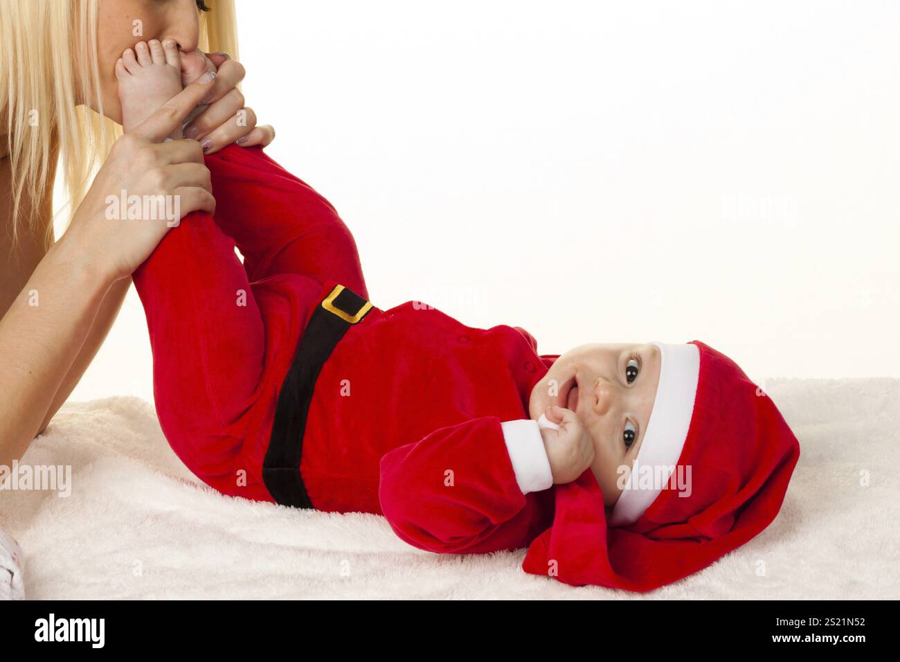 Little baby dressed up as Father Christmas. Toddler dressed as Santa ...