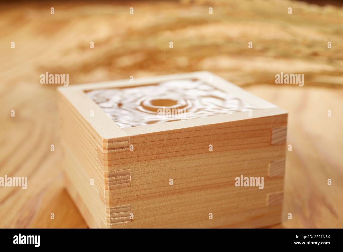 Sake in Masu Box Stock Photo - Alamy