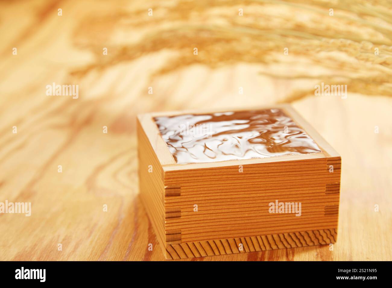 Sake in Masu Box Stock Photo - Alamy